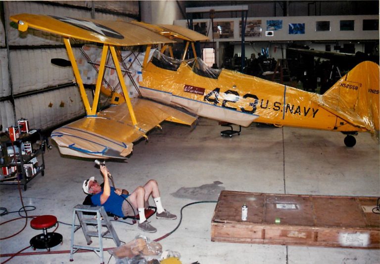 Stearman-12-Wing-tip-repair-spraying-silver - GossHawk Unlimited, Inc.